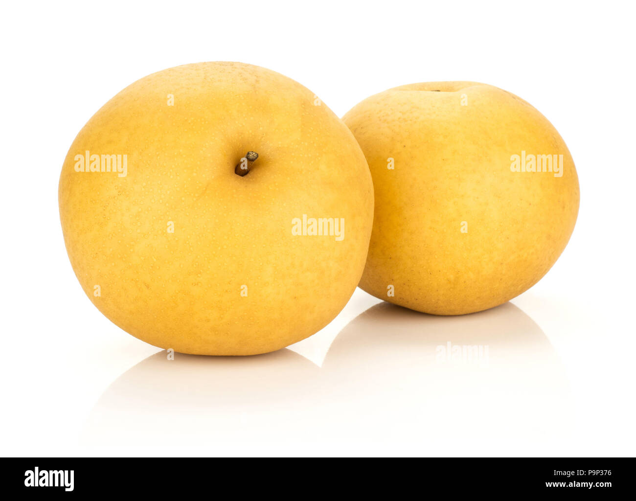 Chinese golden pears Nashi variety isolated on white background two ...