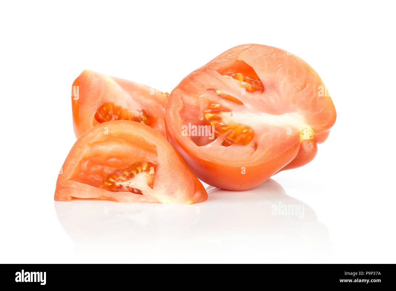 Sliced beef tomato (one section half two cut pieces) isolated on white ...