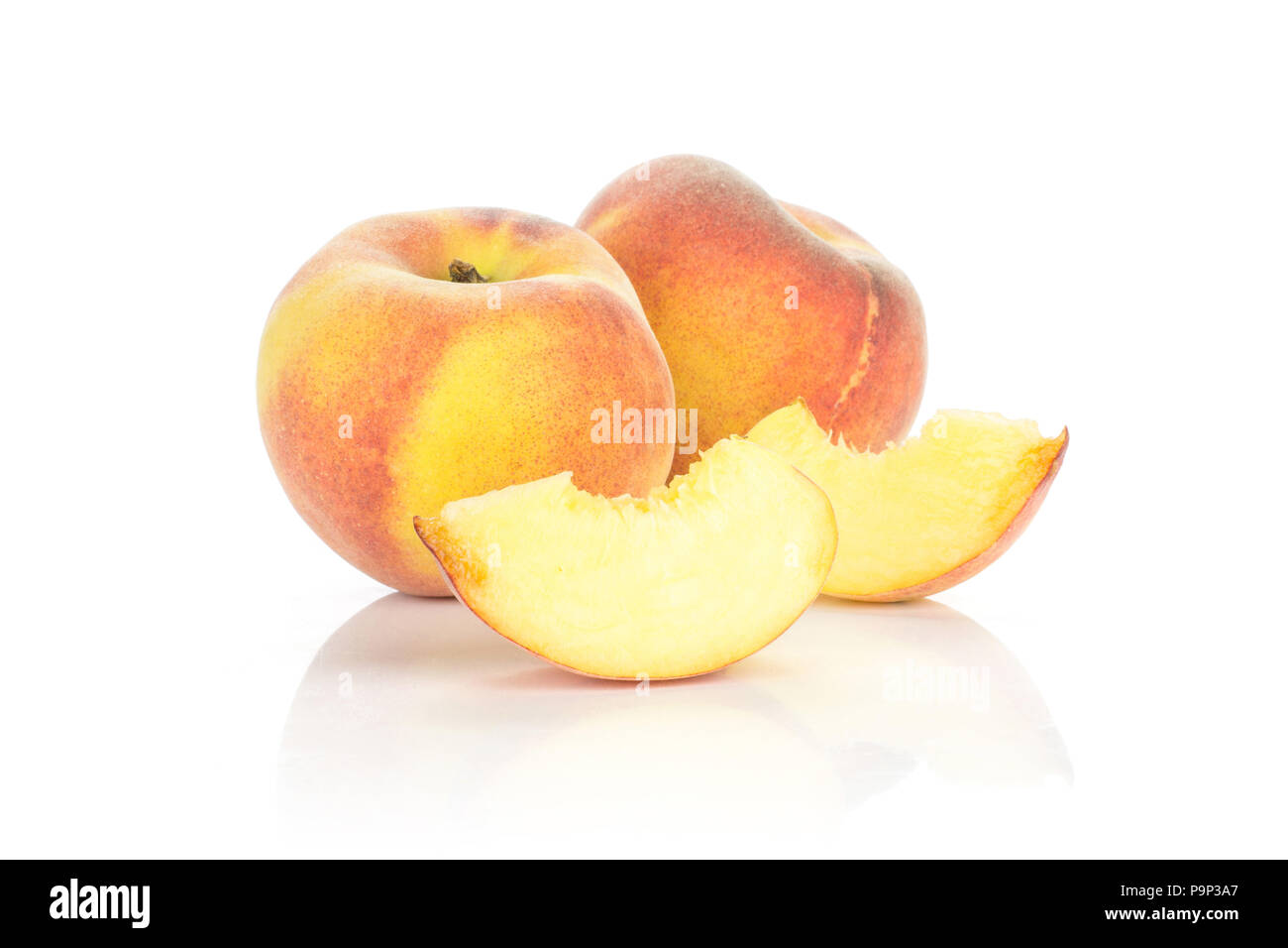 Ripe yellow peaches with two slices isolated on white background Stock ...