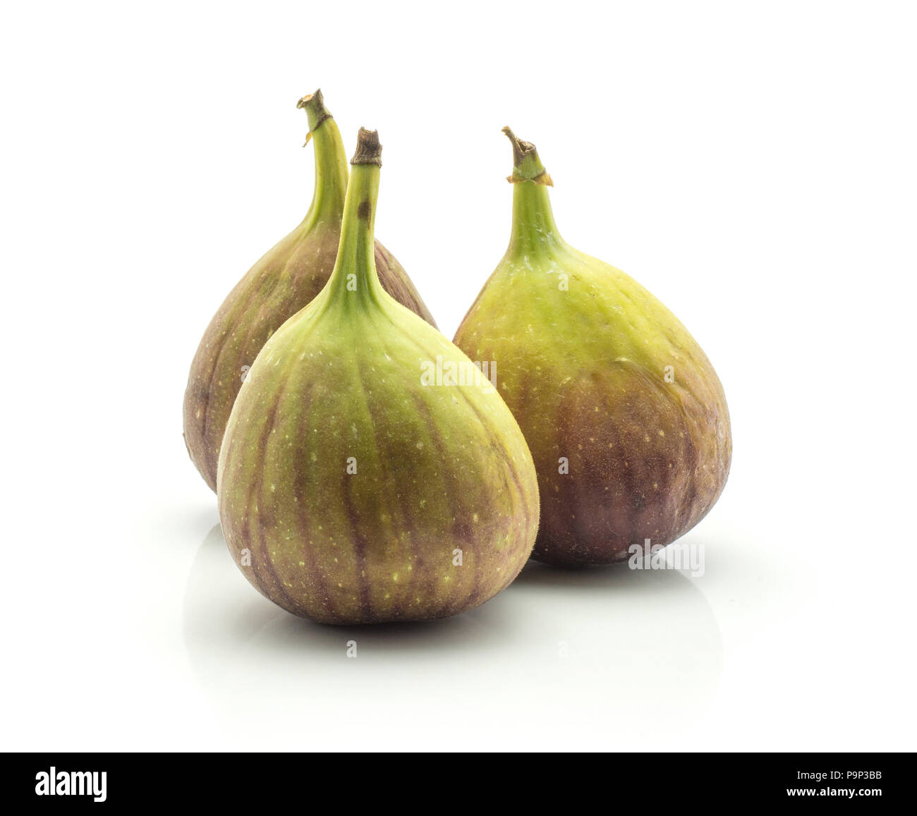 Three fresh figs isolated on white background ripe purple green Stock ...