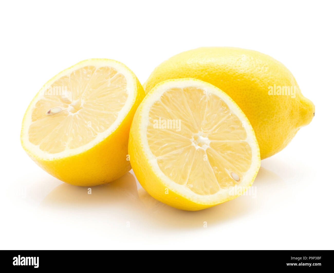 Sliced lemon two halves and one whole isolated on white background ...