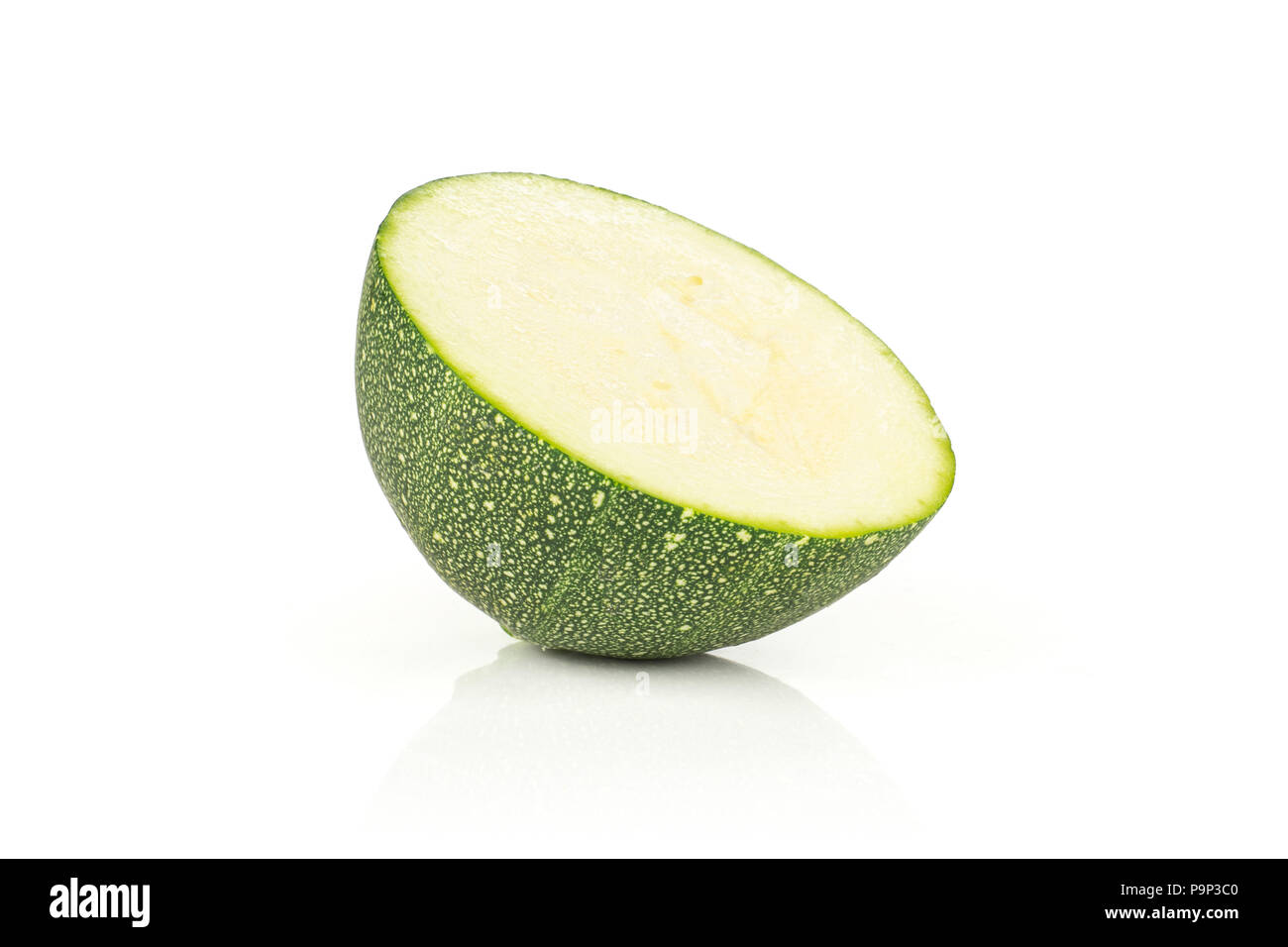 One round zucchini cut half isolated on white background fresh summer ...