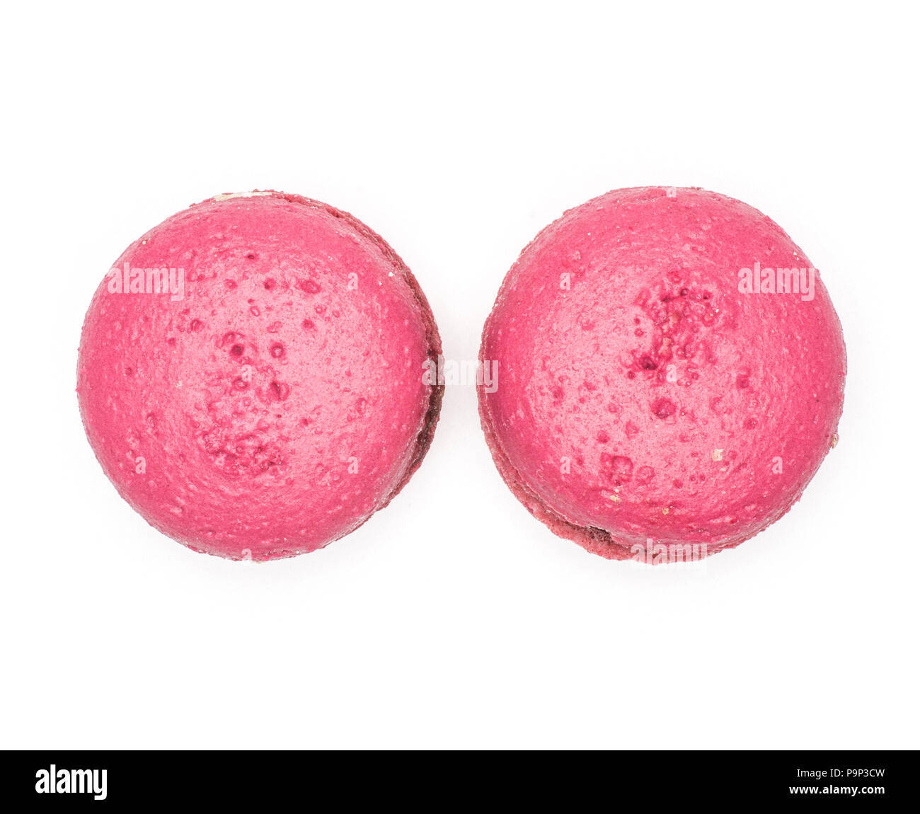 Pink French macarons top view isolated on white background two with ...