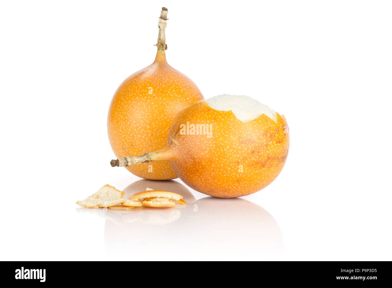 Two giant grenadilla one broken with skin pieces isolated on white ...
