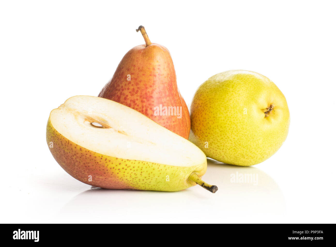 Group of two whole one half of fresh red pear forelle variety isolated ...