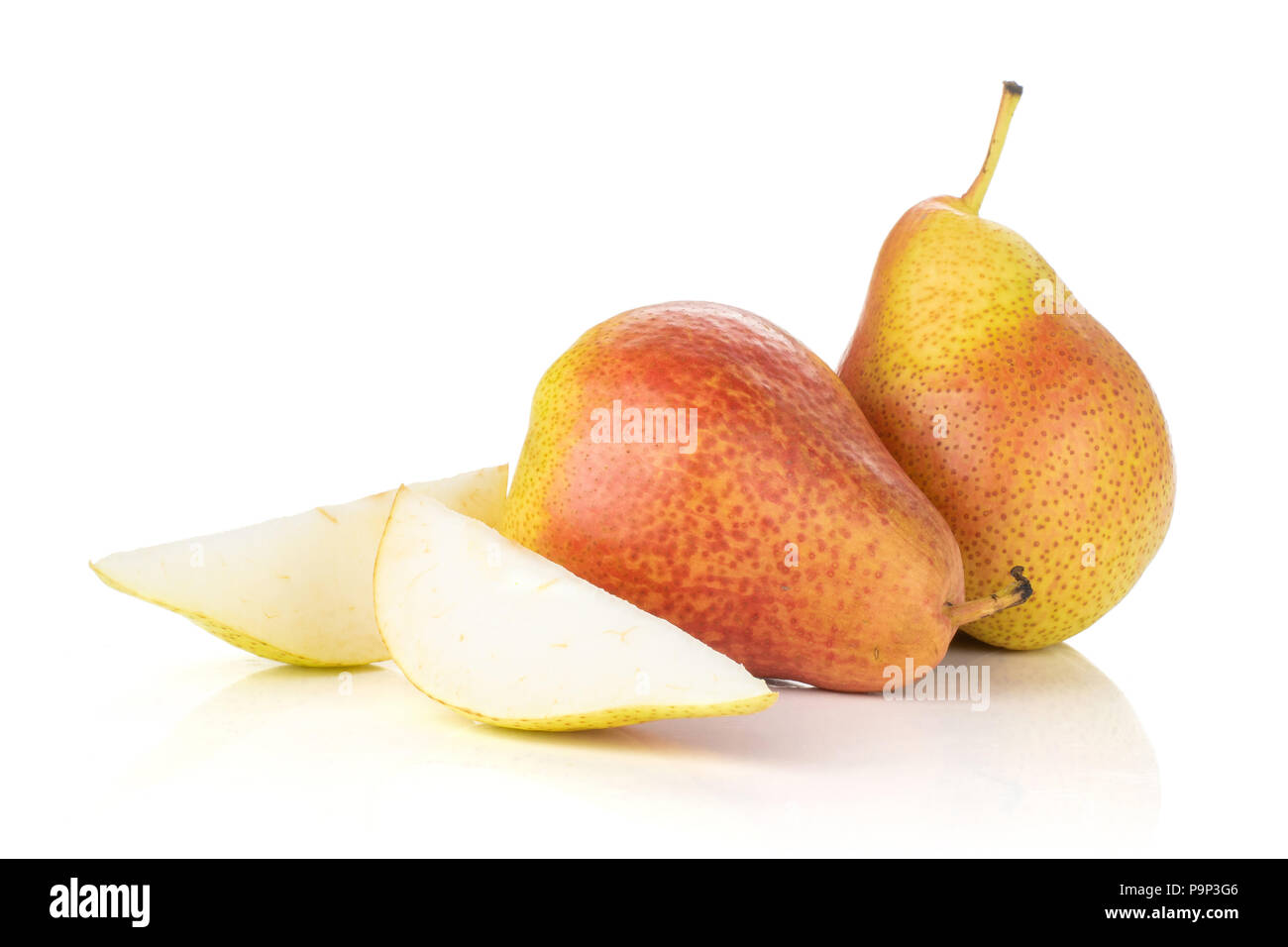 Group of two whole two slices of fresh red pear forelle variety ...