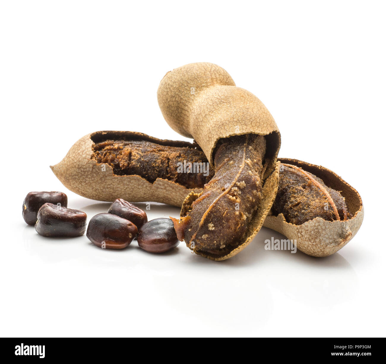 Two open tamarind with glossy seeds isolated on white background Indian ...