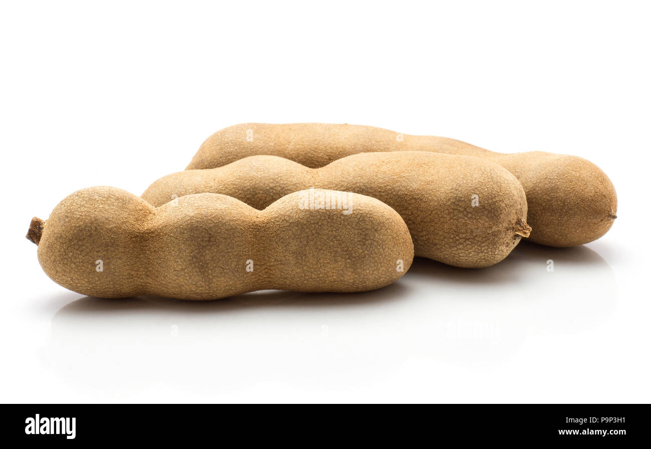 Three brown tamarind isolated on white background Indian dates in a ...