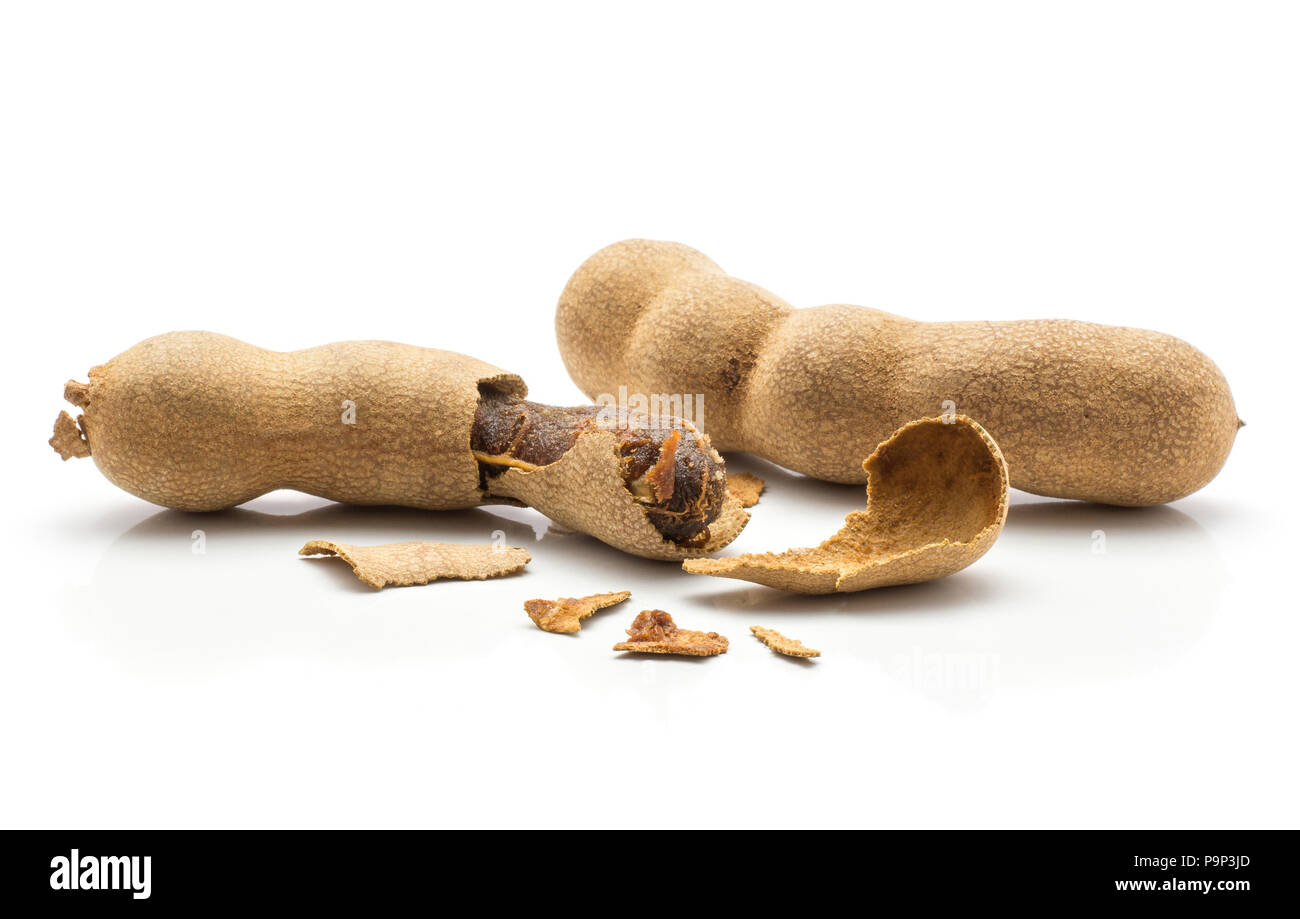 Two tamarind one broken isolated on white background Indian dates in a ...