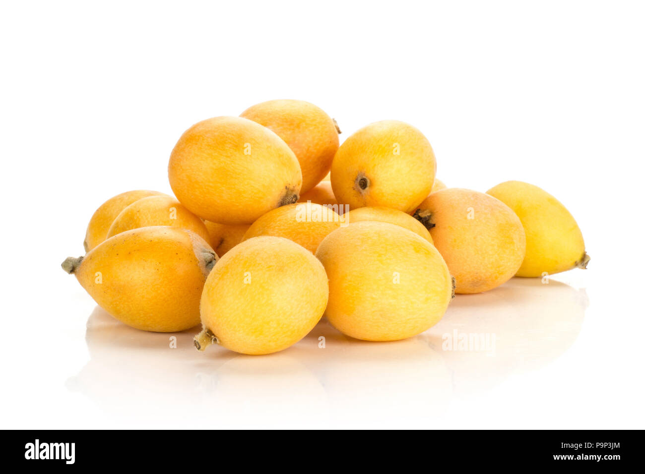 Fresh Japanese loquats stack isolated on white background Stock Photo ...