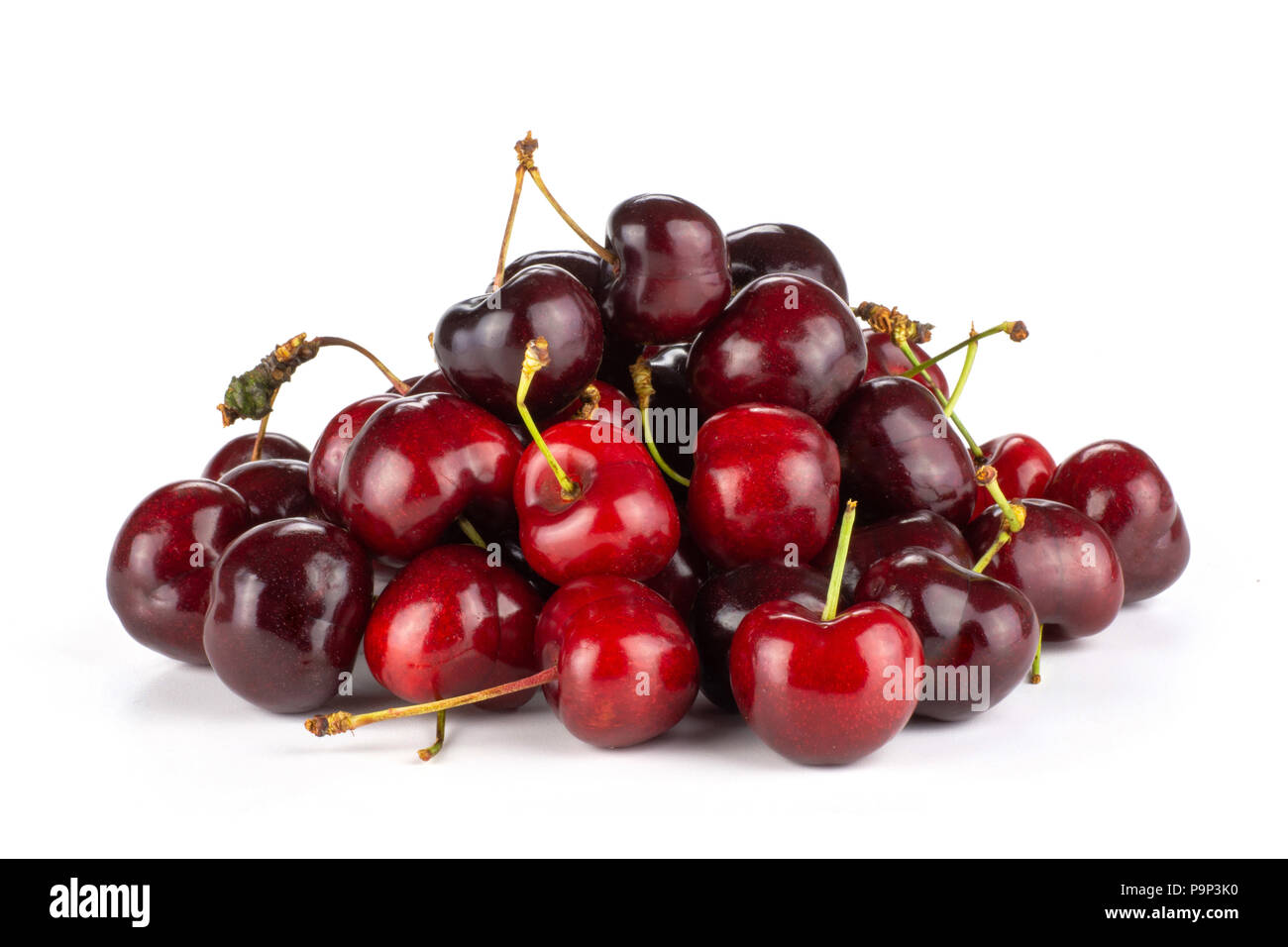 Sweet bright red cherry stack isolated on white Stock Photo - Alamy