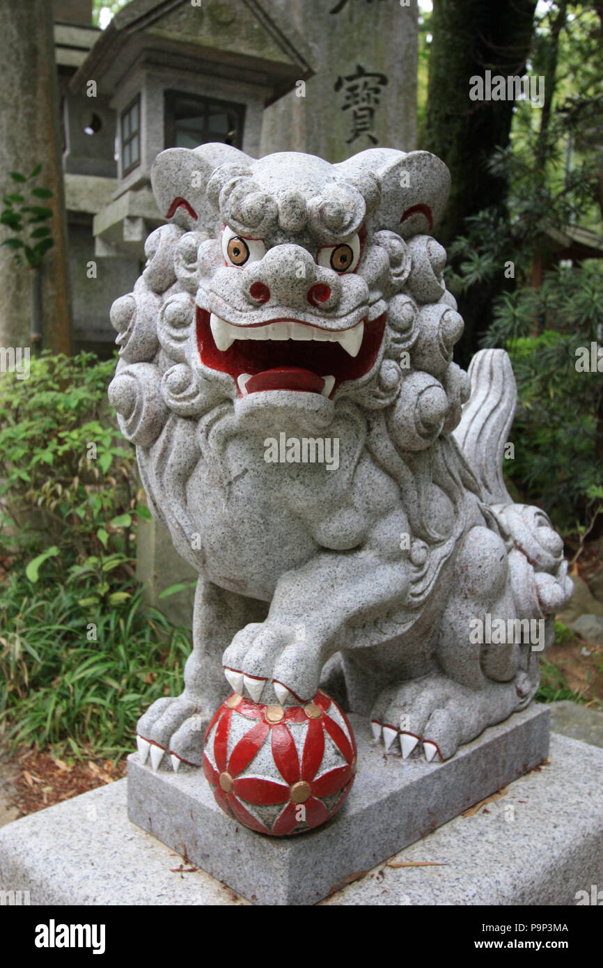 carved stone statue of mythical animal in Japan Stock Photo - Alamy