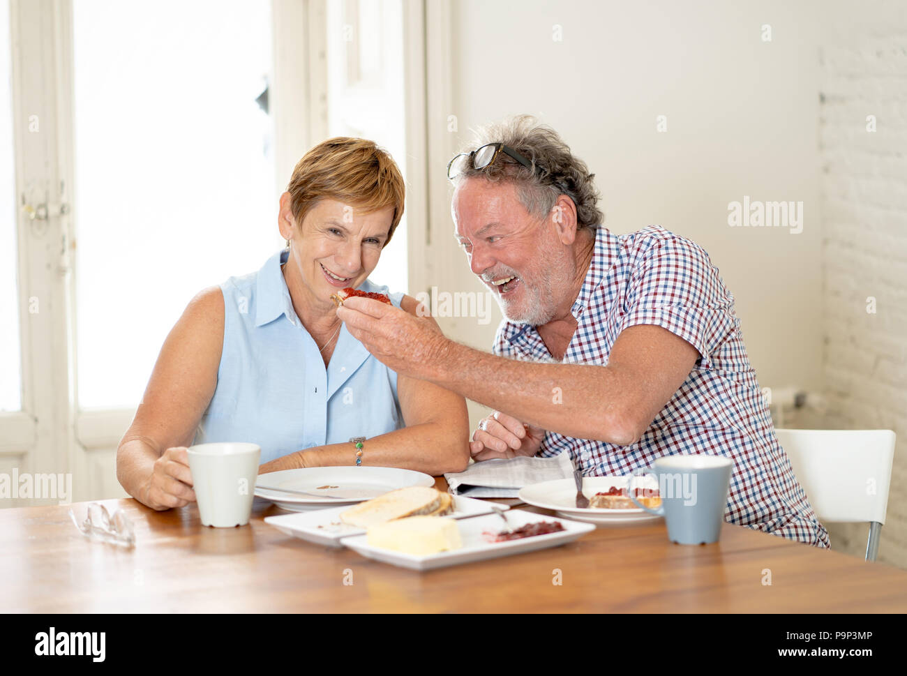 Portrait Of A Attractive Mature Retired Couple Having Breakfast