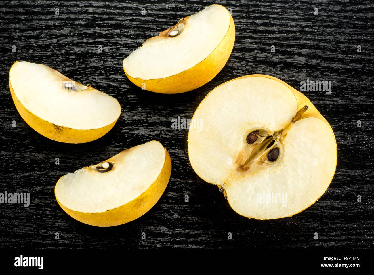Chinese golden pears top view Nashi variety isolated on black wooden ...