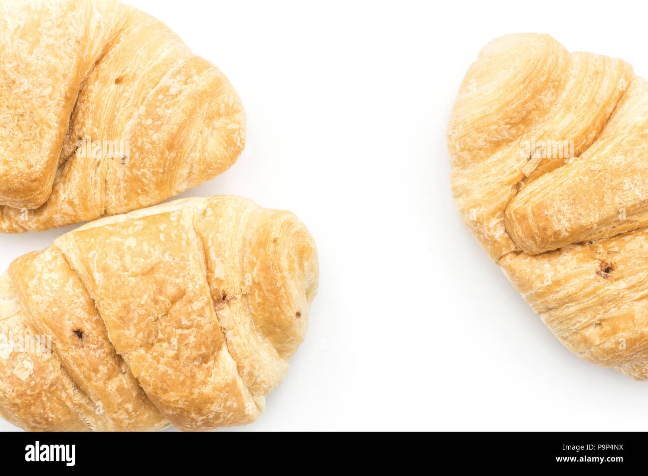 Three croissants or cornetto background isolated on white (top view ...