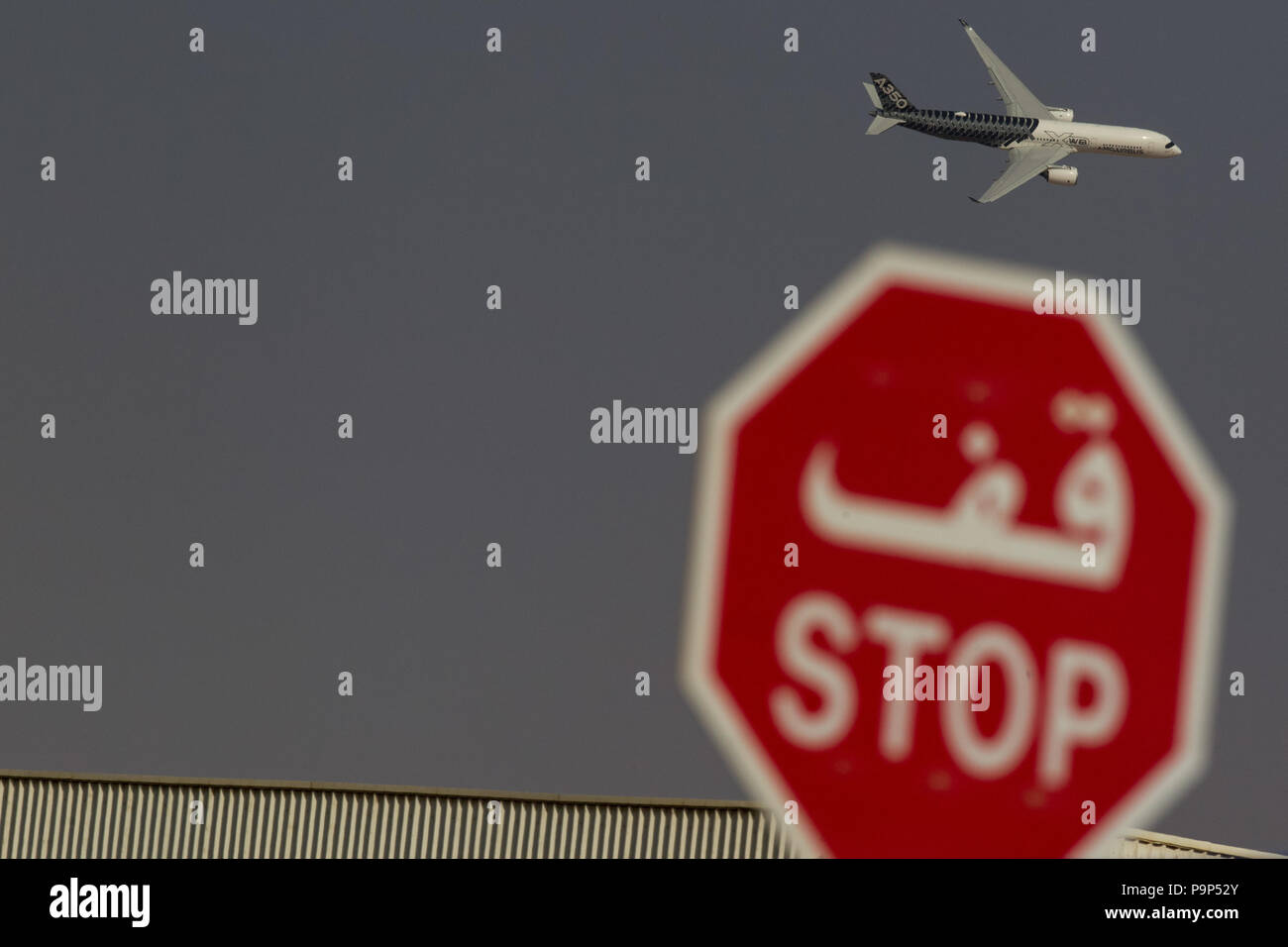 The Airbus A350 performs its demo flight over a 'STOP' traffic sign at ...