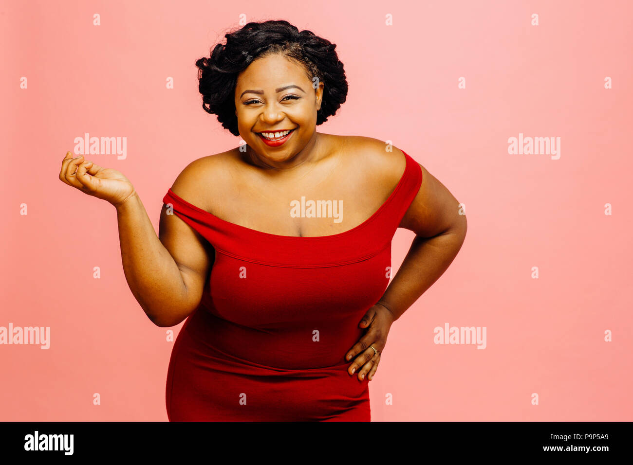 Happy beautiful plus size model smiling Stock Photo - Alamy