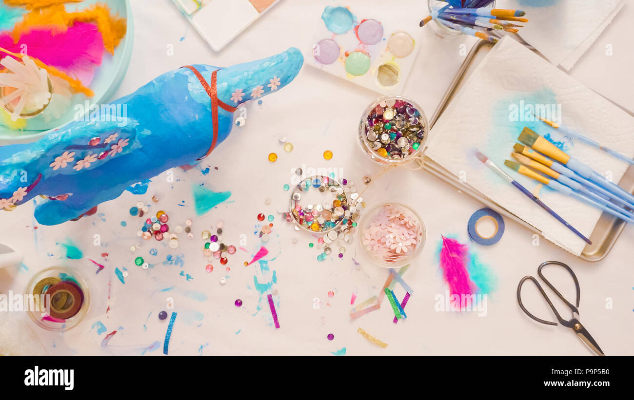 Step by step. ecorating painted paper mache unicorn with paper flowers ...