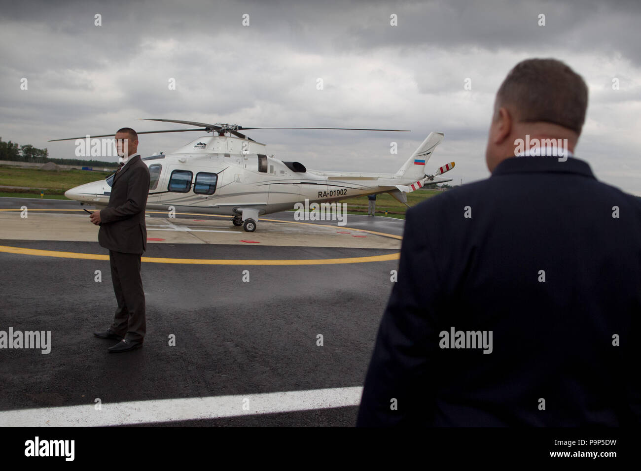 The AgustaWestland AW109E helicopter seen on a landing pad near the ...