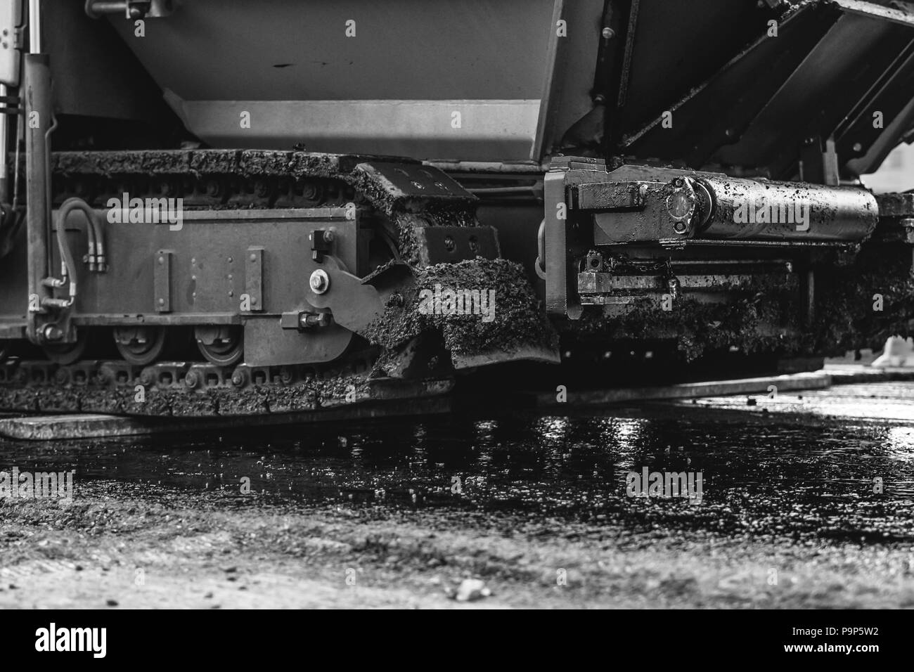 Road construction works with roller compactor machine and asphalt ...