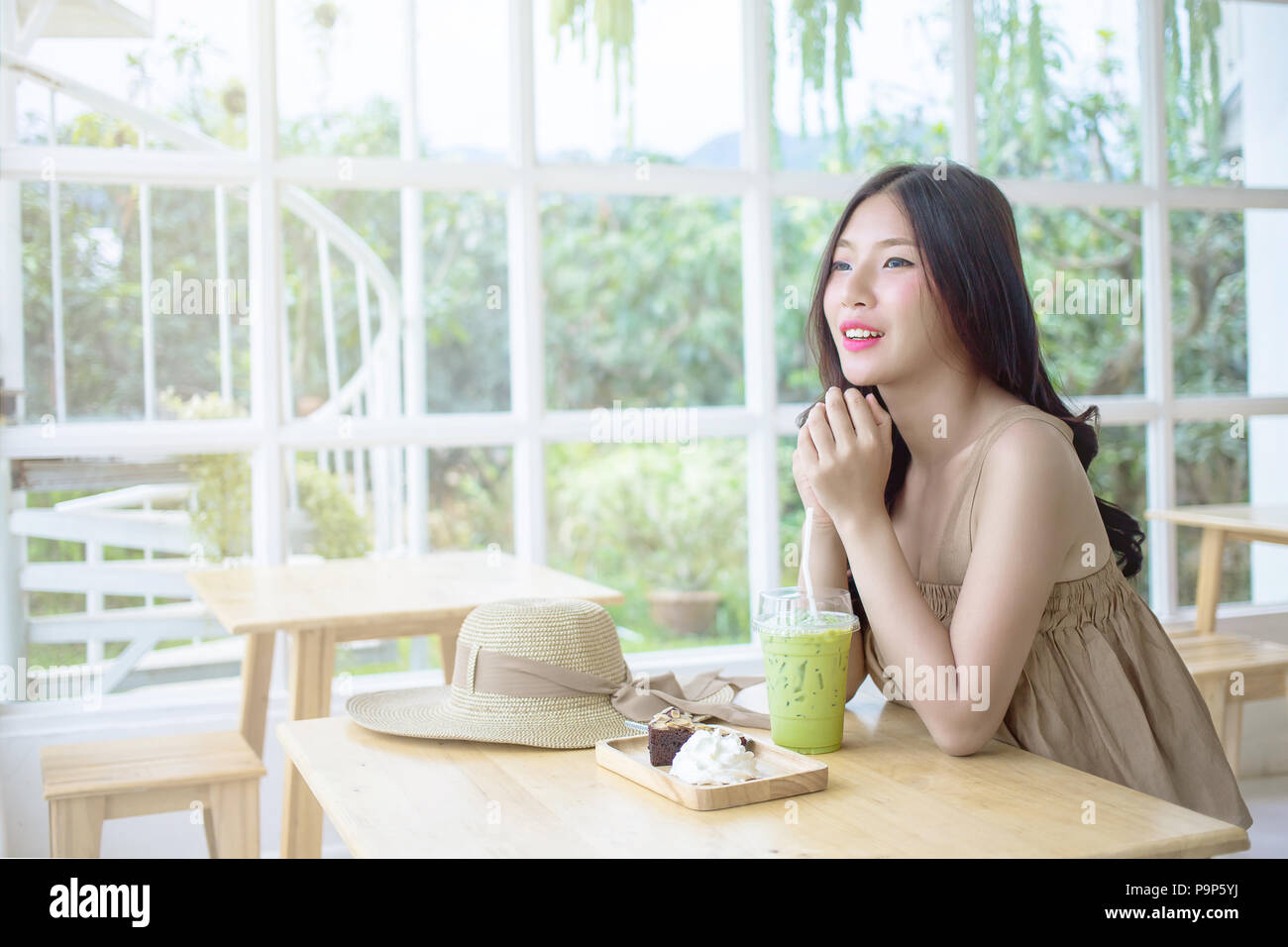 Asian woman tea at in a cafe drinking tea Stock Photo - Alamy