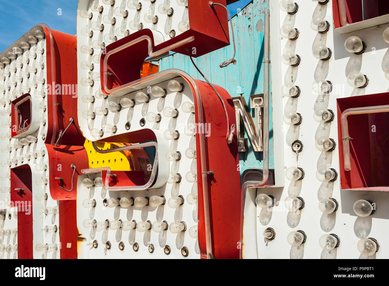 Close-up details of old signs with vintage light bulbs, metal letters ...