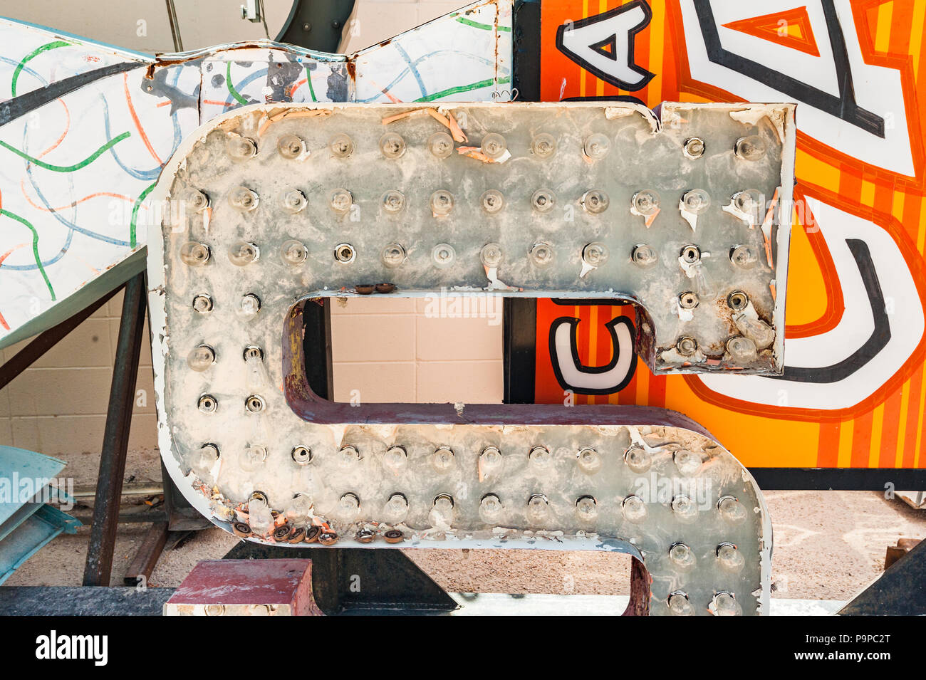 Close-up details of old signs with vintage light bulbs, metal letters ...