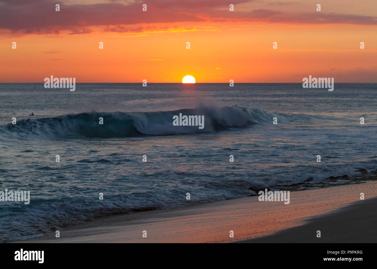 Breaking wave at Sunset in Hawaii Stock Photo - Alamy