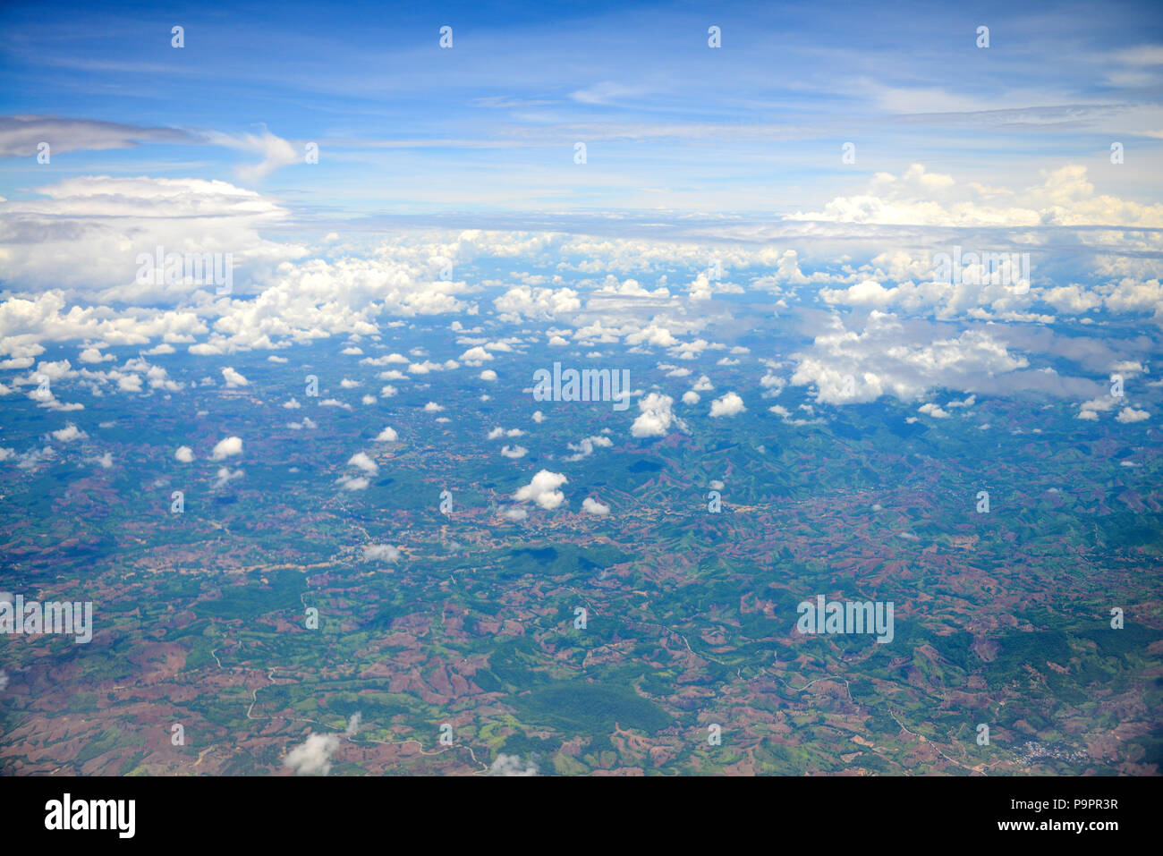 Beautiful view of blue sky above the white clouds and land background ...