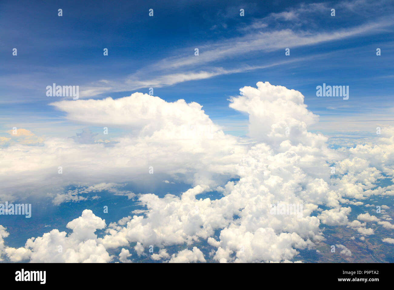 Beautiful view of blue sky above the white clouds and land background ...