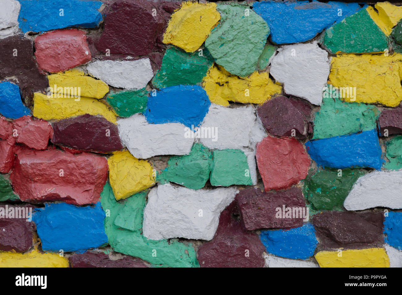 Colored stones on the wall, background for designers Stock Photo - Alamy