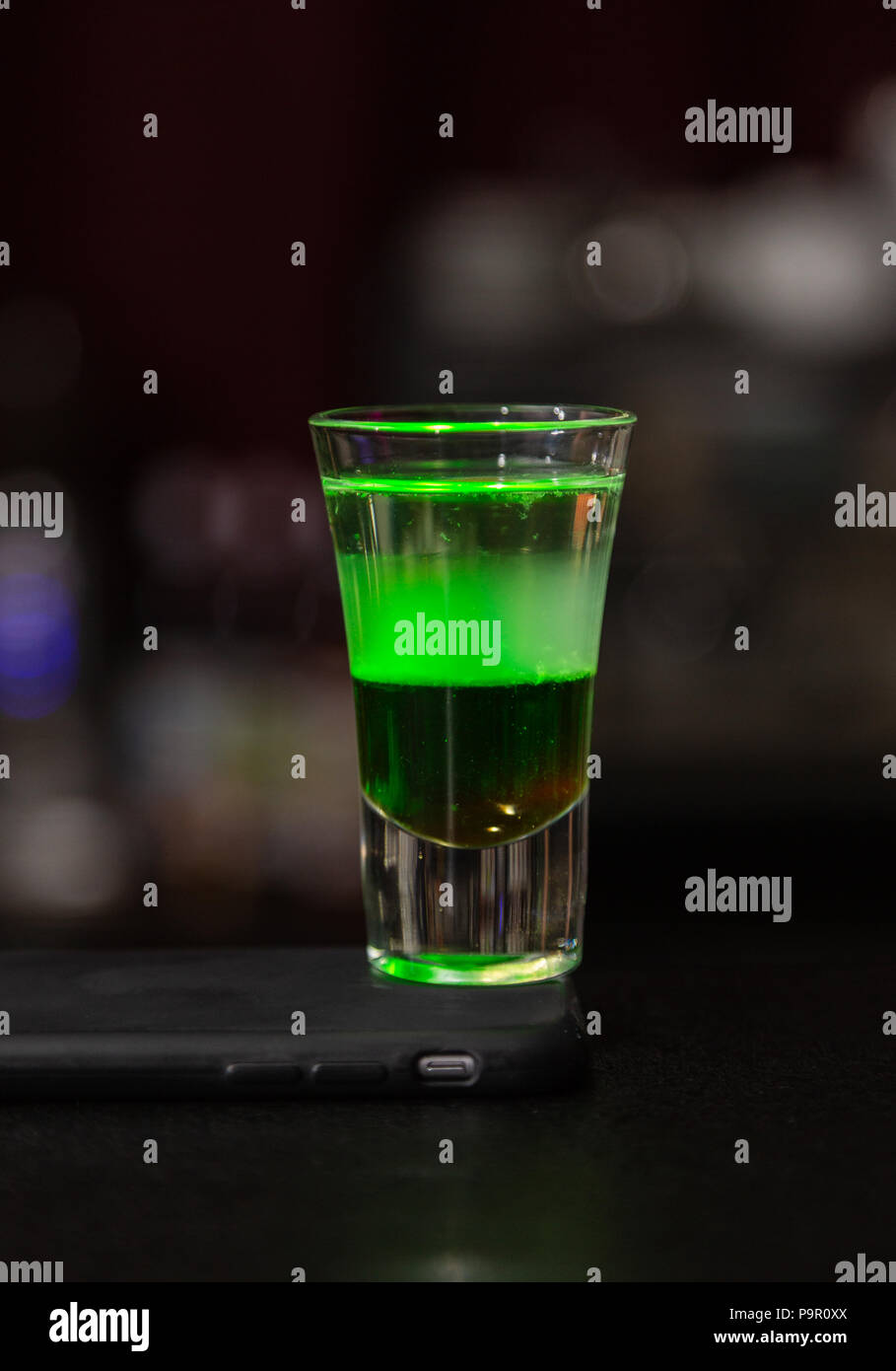Colored cocktail on the bar in the nightclub Stock Photo - Alamy