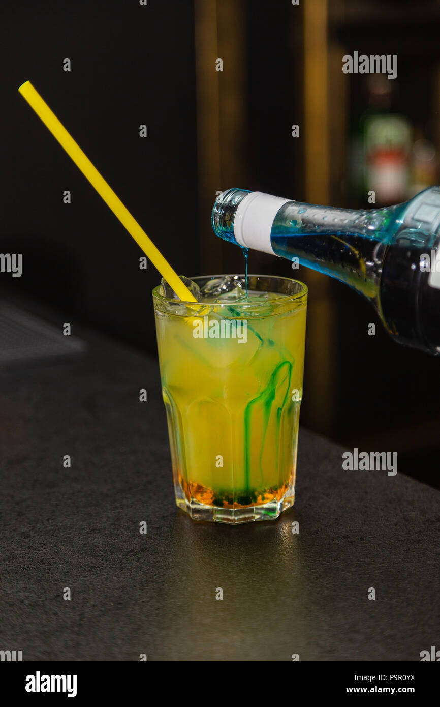 Colored cocktail on the bar in the nightclub Stock Photo - Alamy