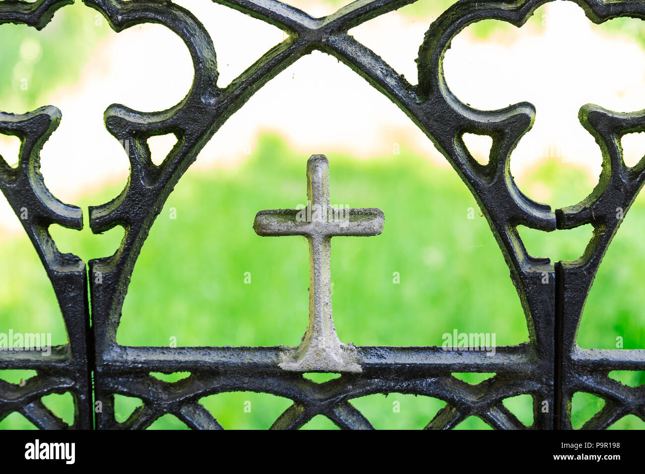 Forged iron fence with an Orthodox cross. Church fence. Summer ...