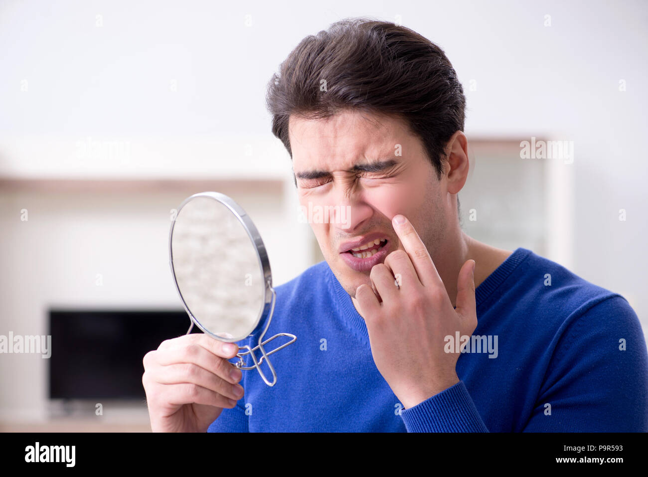 Man panicking because of pimples on the skin Stock Photo - Alamy