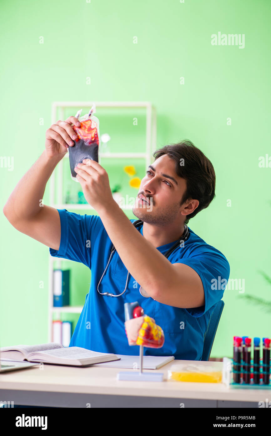 Doctor doing blood analysis in the lab Stock Photo - Alamy