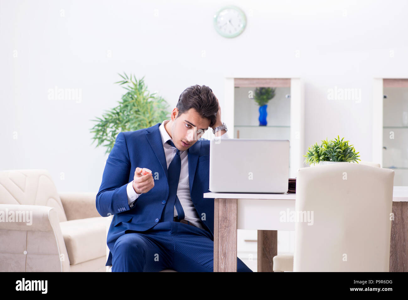 Bankrupt businessman angry and upset at home Stock Photo - Alamy