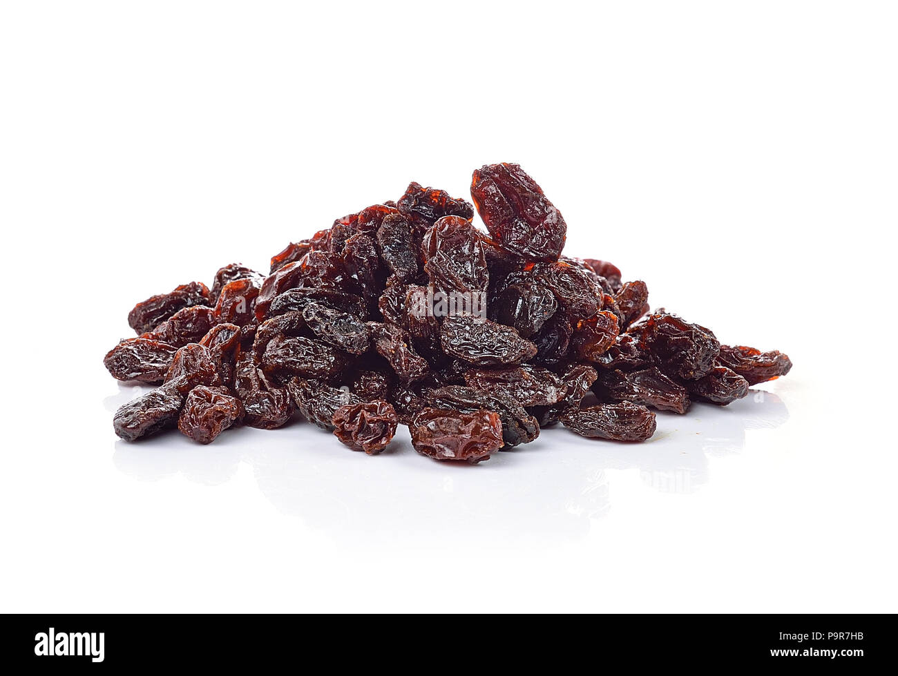 Dried raisins on a white background Stock Photo - Alamy