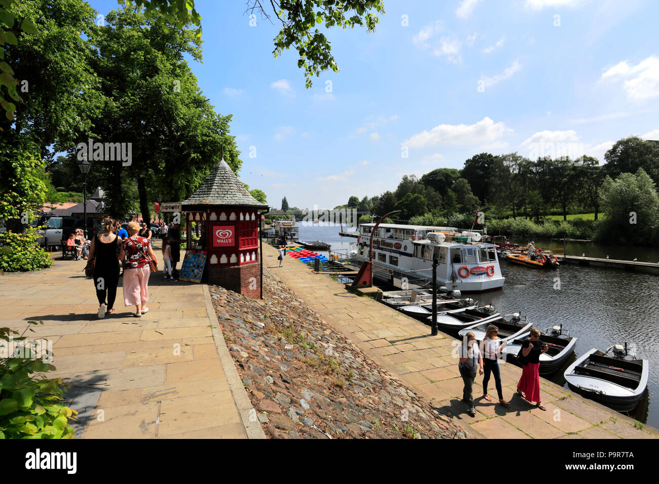 People and boats at the River Dee Embankment, Chester City, Cheshire ...