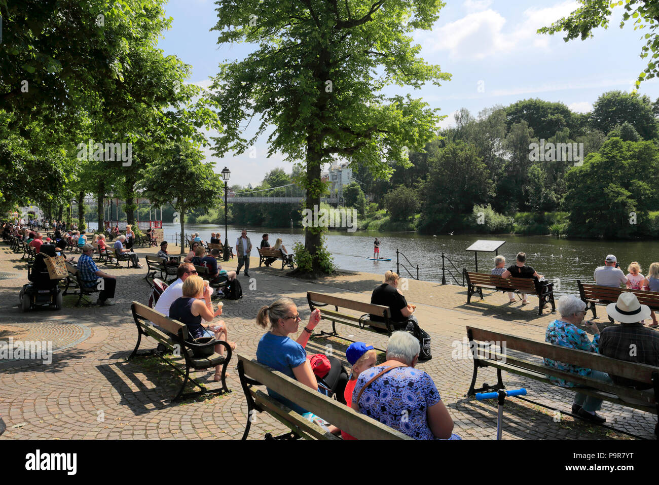 People and boats at the River Dee Embankment, Chester City, Cheshire ...