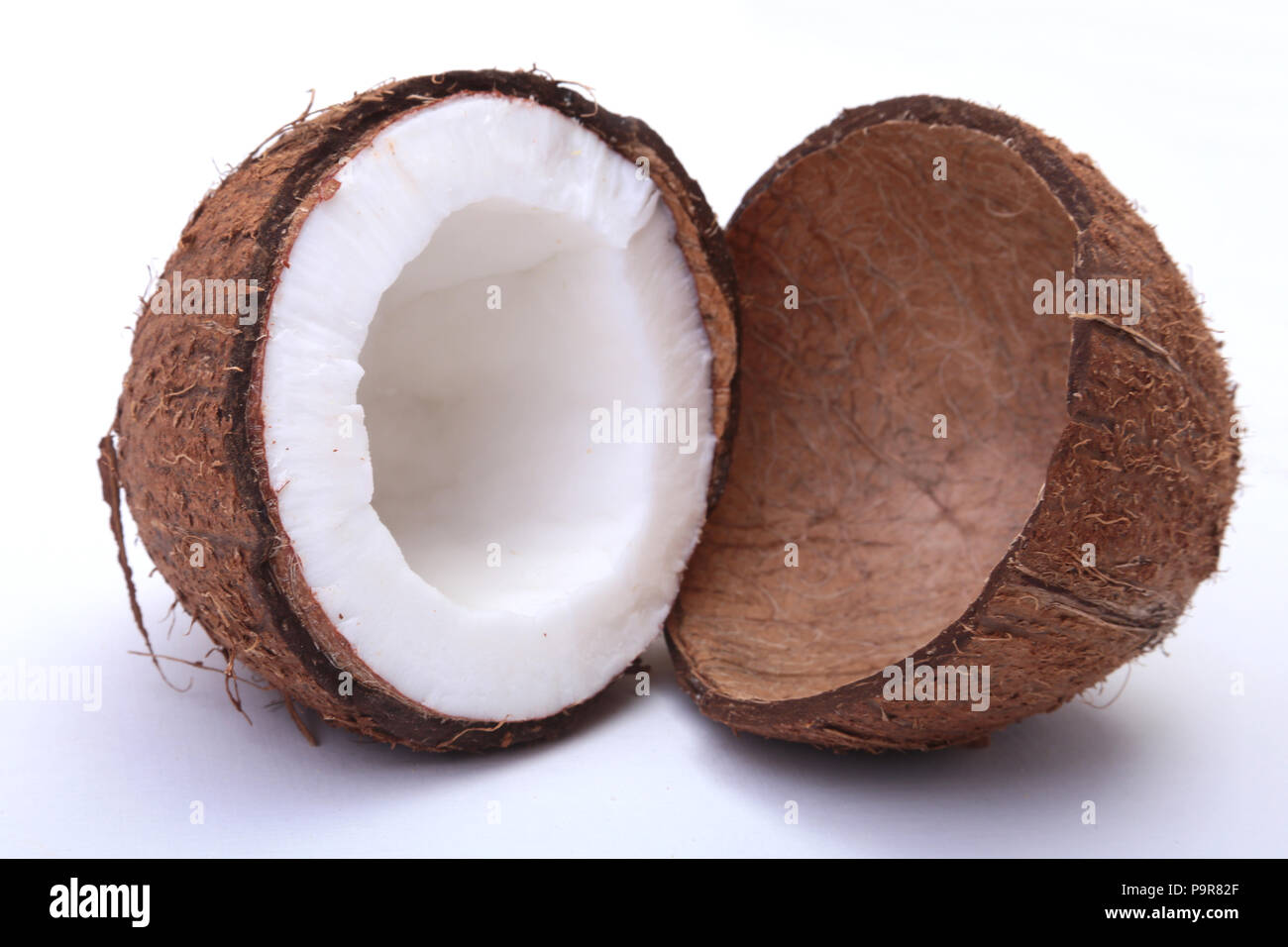 coconuts Half isolated on the white background Stock Photo - Alamy