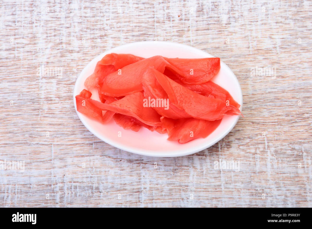 plate with Japanese pickled ginge on wood background Stock Photo - Alamy
