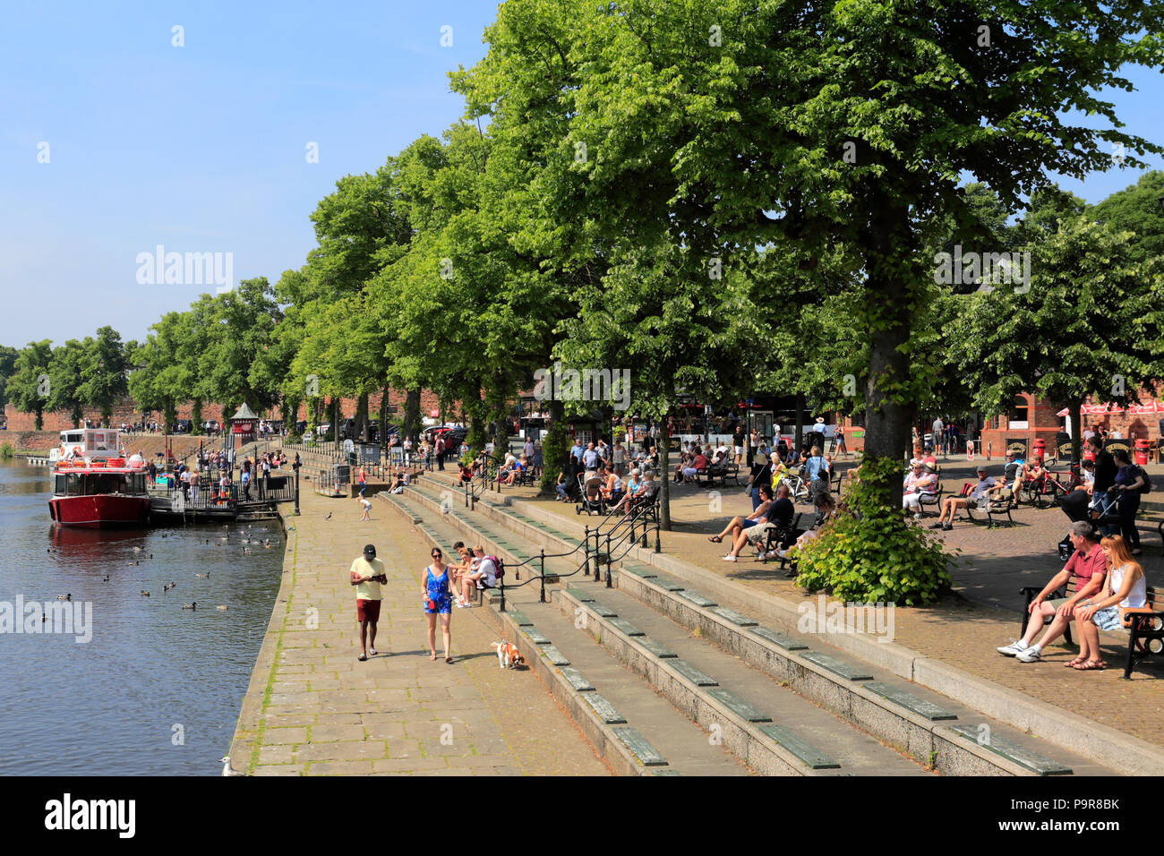 People and boats at the River Dee Embankment, Chester City, Cheshire ...