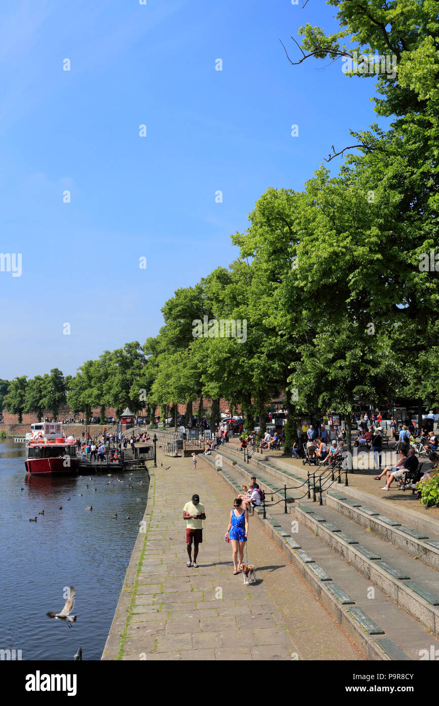 People and boats at the River Dee Embankment, Chester City, Cheshire ...