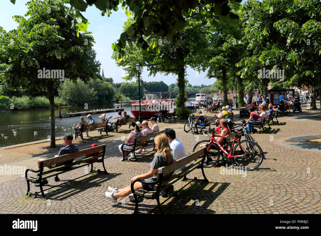 People and boats at the River Dee Embankment, Chester City, Cheshire ...