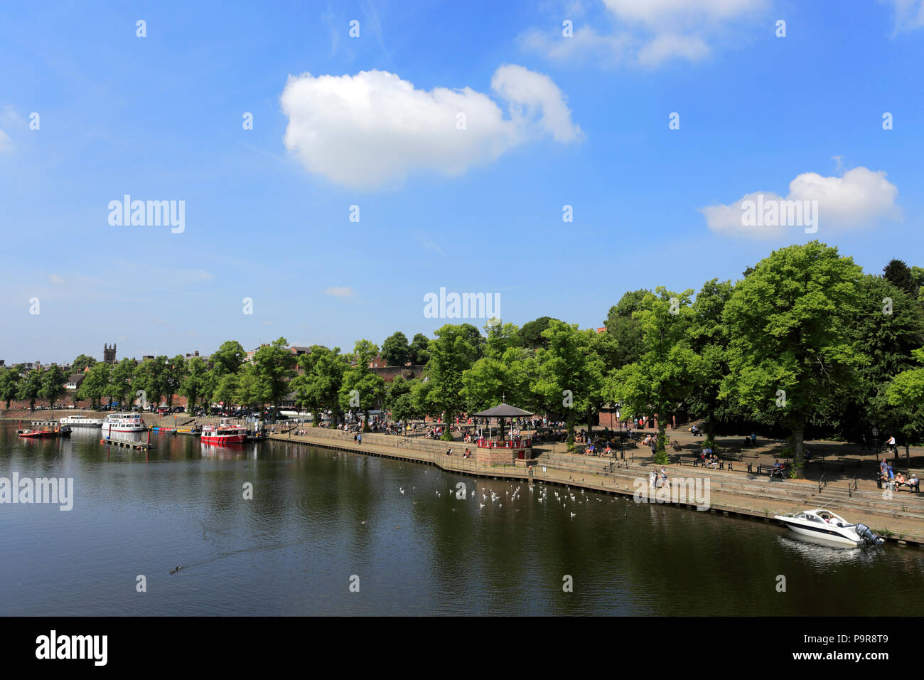 People and boats at the River Dee Embankment, Chester City, Cheshire ...