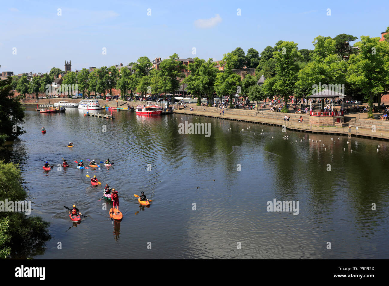 People and boats at the River Dee Embankment, Chester City, Cheshire ...