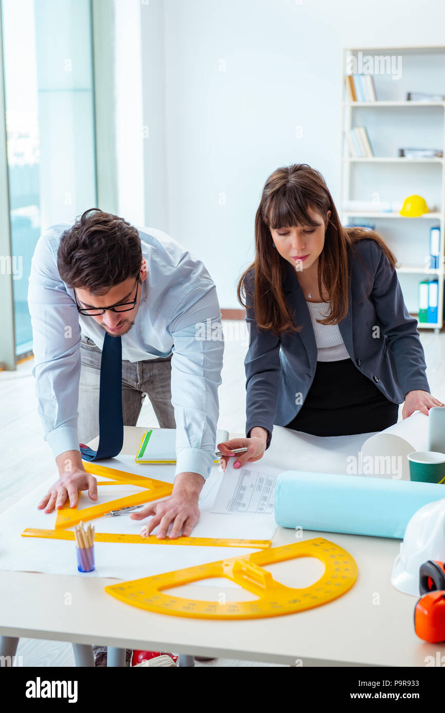 Engineers studying blueprint table hi-res stock photography and images ...