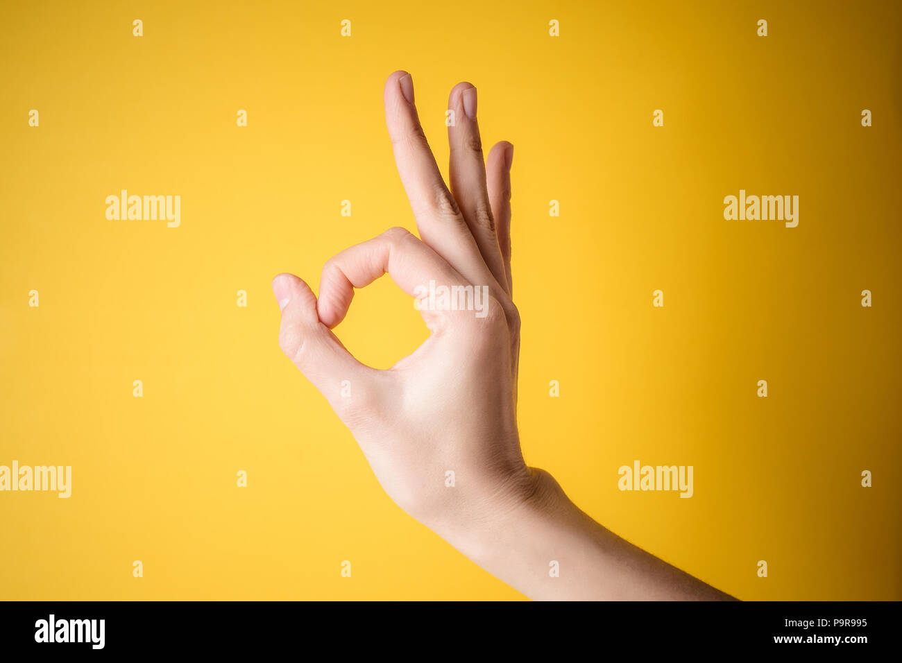 woman hand pointing up okay, yes, accepting hand sign to the side ...