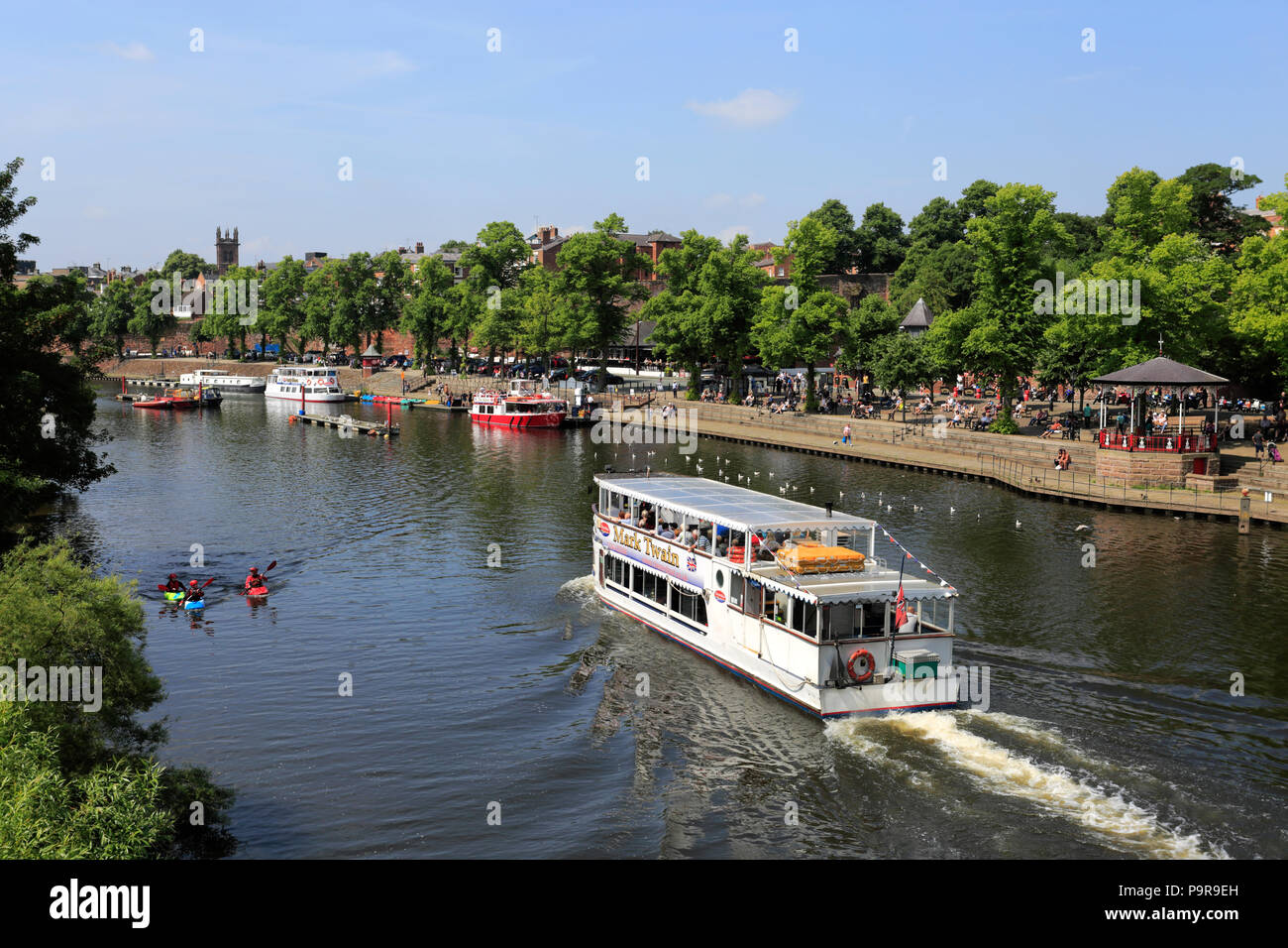 People and boats at the River Dee Embankment, Chester City, Cheshire ...